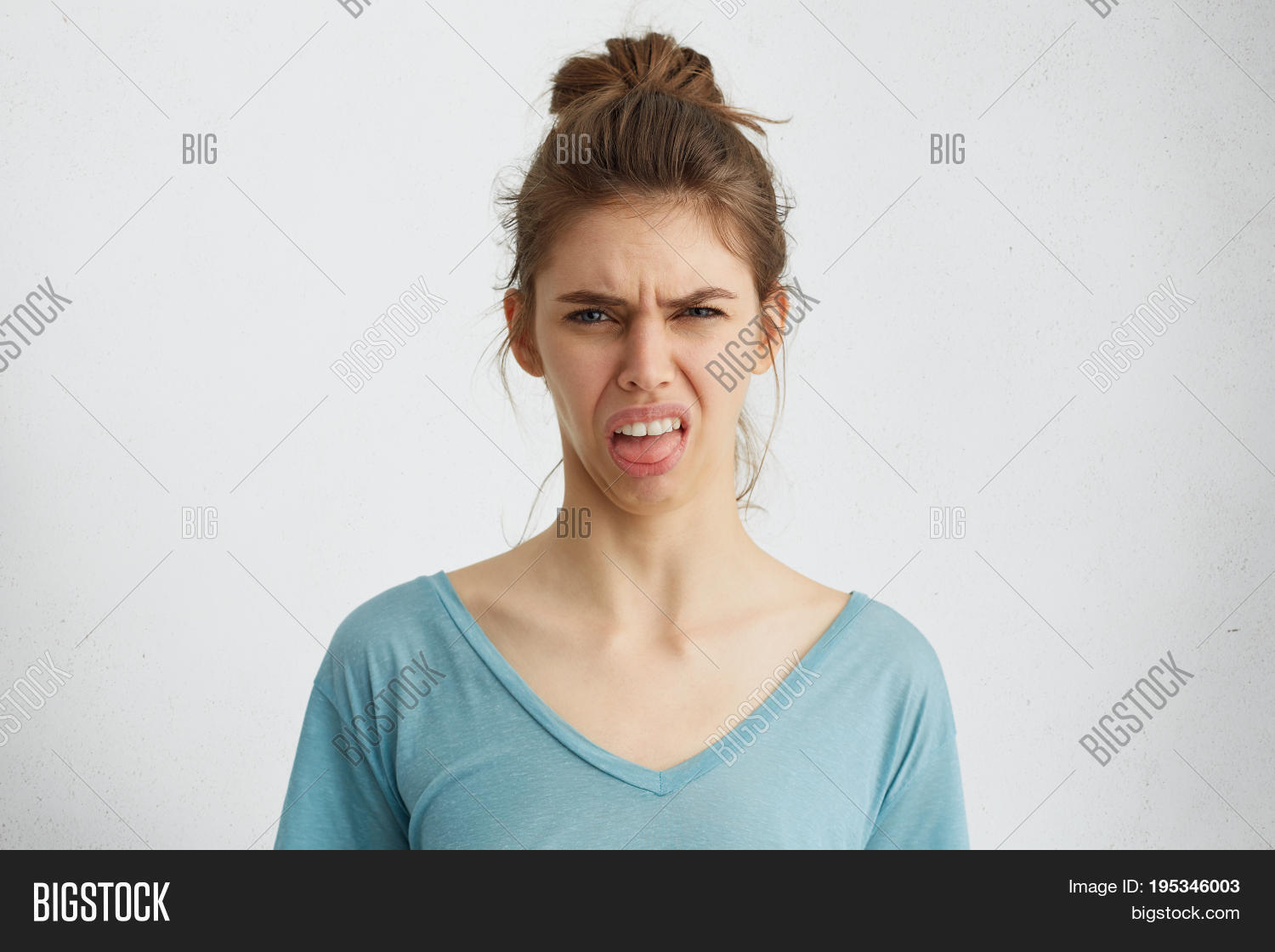 Grumpy Woman Showing Her Disgust While Frowning Face With ...