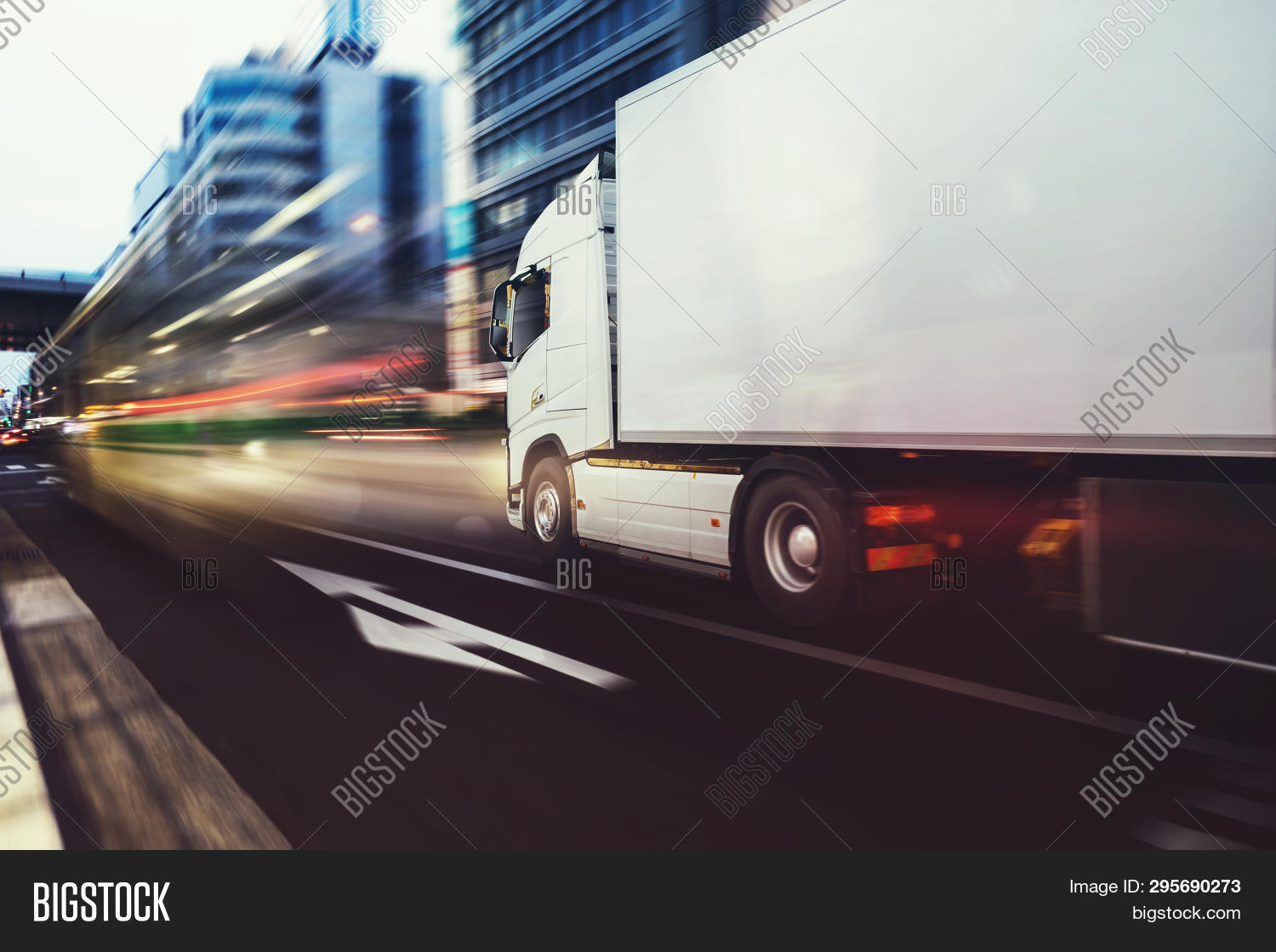 White Truck Moving Fast On The Road In A Modern City With Light Effect ...