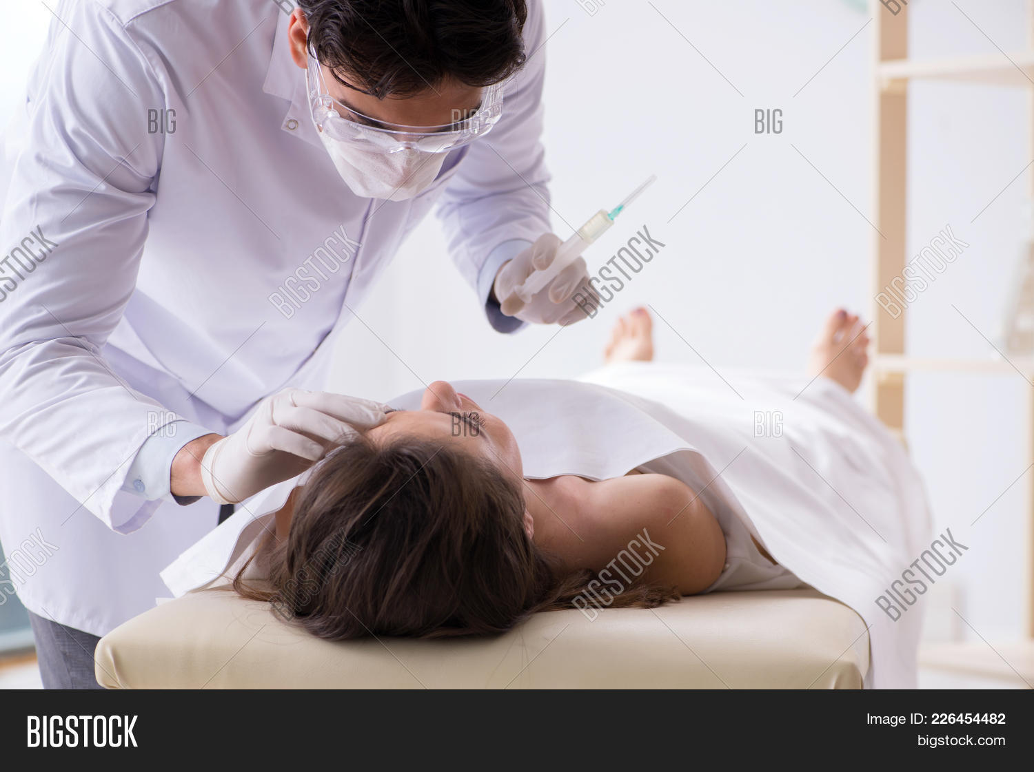 Police coroner examining dead body corpse in morgue image & stock photo ...