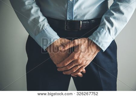 Man With Hands Holding His Crotch On Gray Background image & stock ...