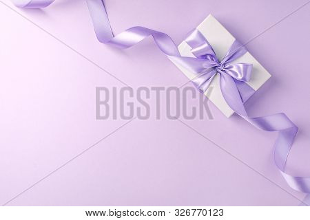 Craft Gift Box On A Lilac Background, Decorated With A Textured Bow And ...