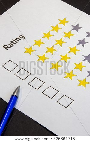 Rating With 5 Stars Selection With Black Background And Pen In English ...