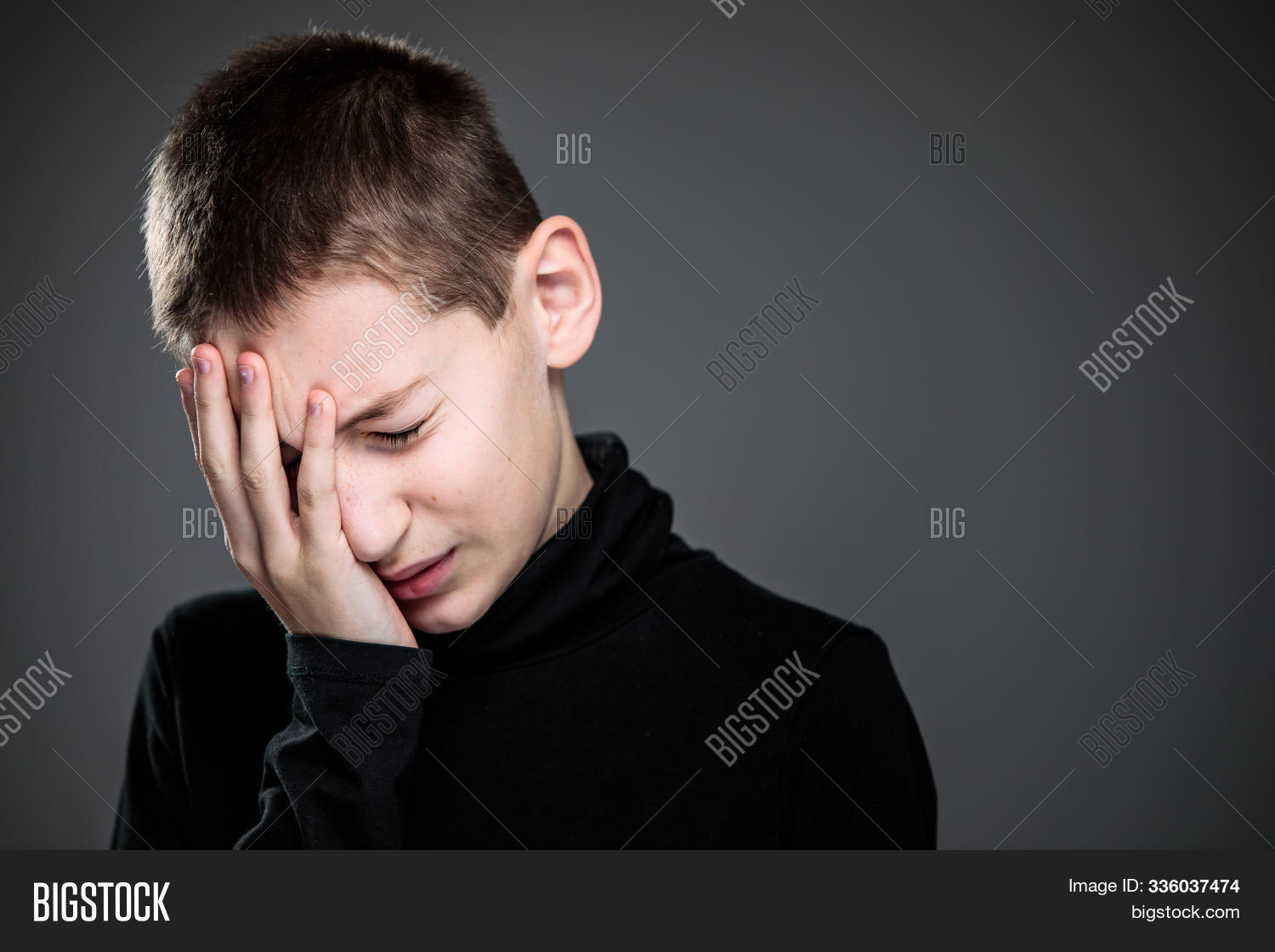 Grief-stricken little boy - feeling intense sorrow, remorse, sadnesss ...