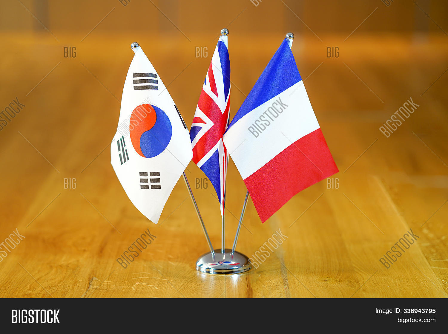 Three Flags On The Table. Flags Of South Korea, United Kingdom And ...