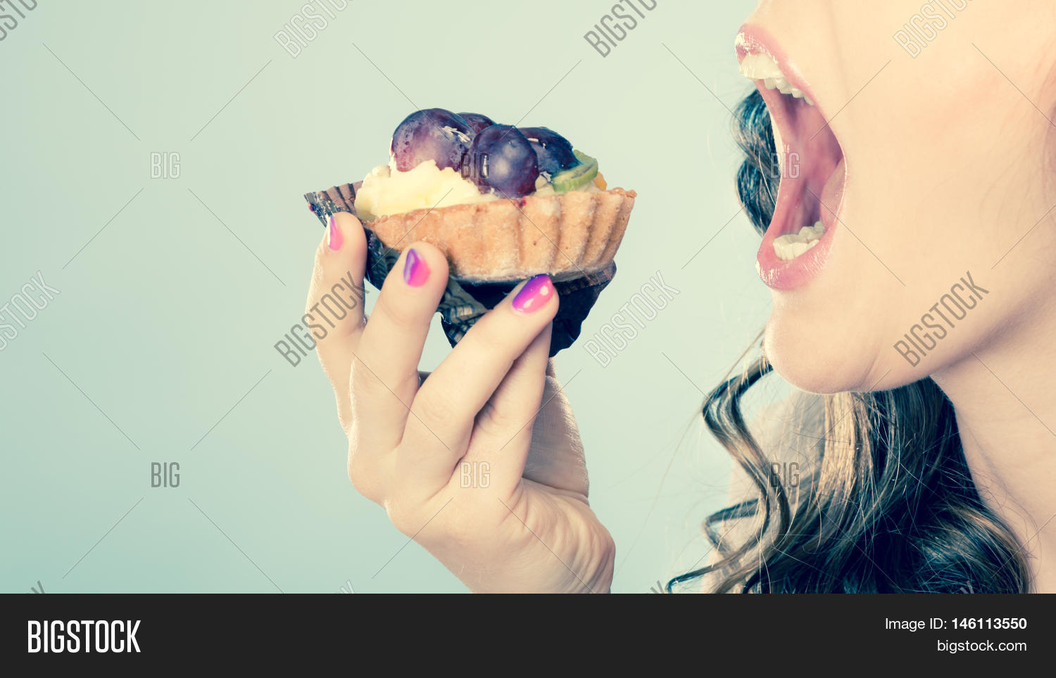 Woman Face Profile Open Mouth Eating Cake image & stock photo. 146113550