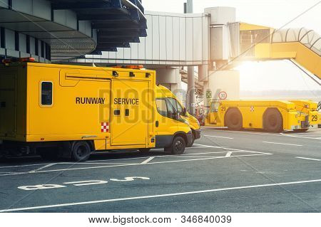 Runway Service Vehicles Standing On Tarmac Near Airport Terminal ...