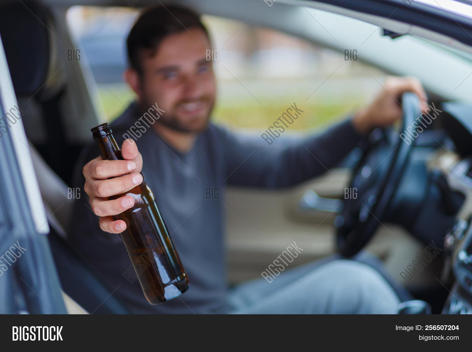 A Tipsy Man In The Car. Man Drinking Alcohol While Driving The Car ...