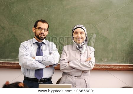 classroom with two muslim arabic teachers, male and female image ...
