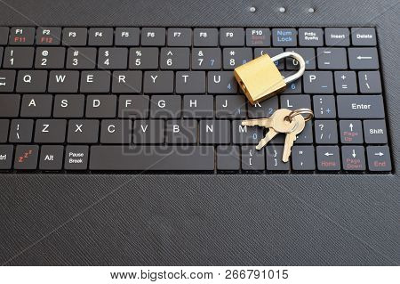 Golden Locked Padlock And Keys On Black Computer Laptop Or Tablet ...