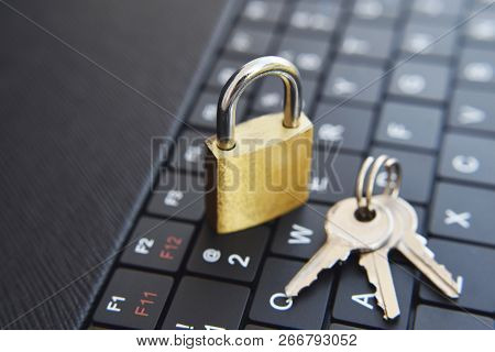 Golden Locked Padlock And Keys On Black Computer Laptop Or Tablet ...