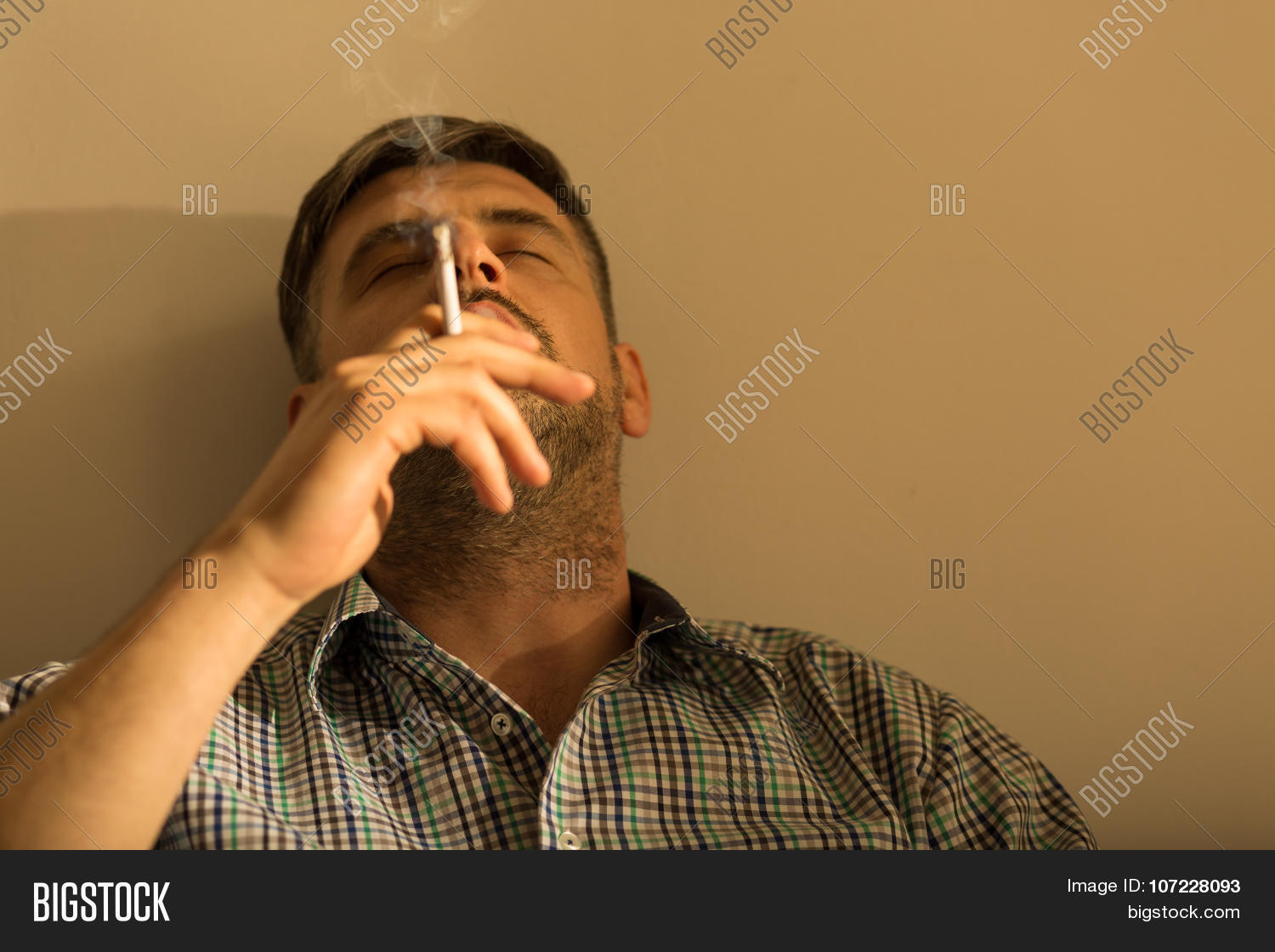 Man Smoking A Cigarette image & stock photo. 107228093