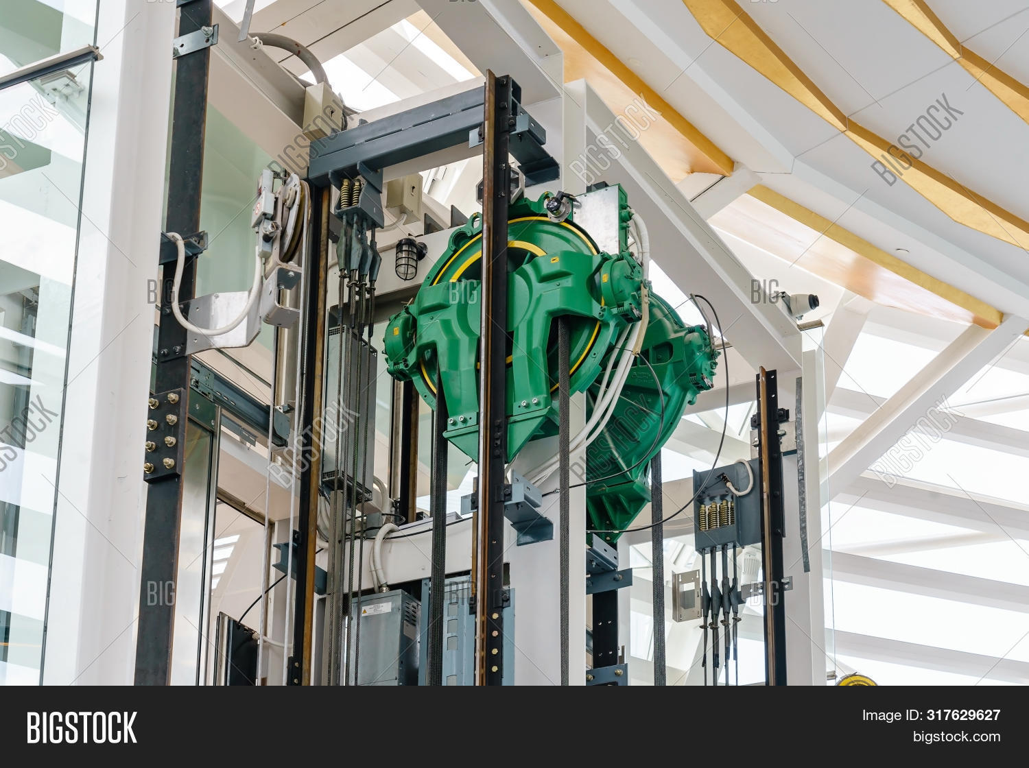 Elevator Engine Room With Elevator Motor. Motor Driven Elevator Cable ...