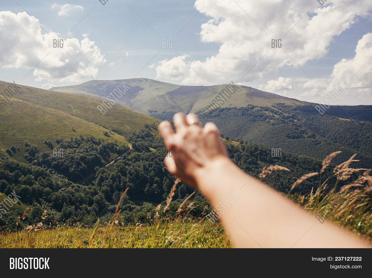 Traveler Hand Reaching Out To Mountains. Focus On Hills. Girl Hand On ...