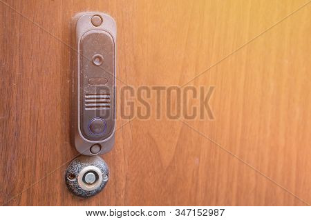 The Modern Intercom With A Magnetic Key Space Is Mounted On A Wooden ...