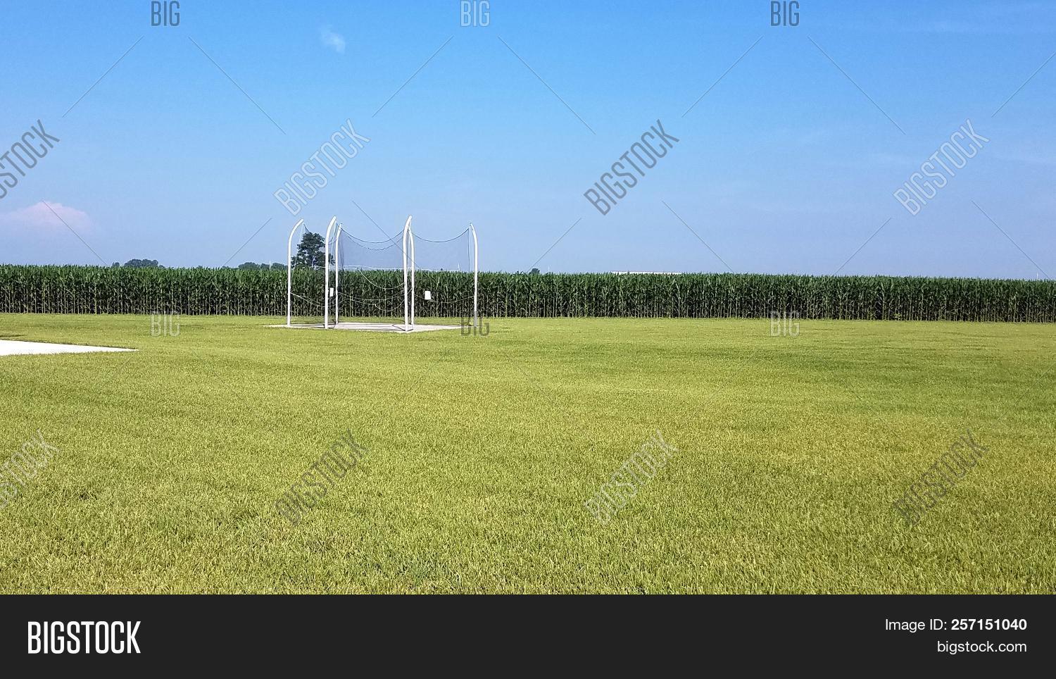 Track And Field Discus, Hammer And Shot Put Cage On A Green Grass Field ...