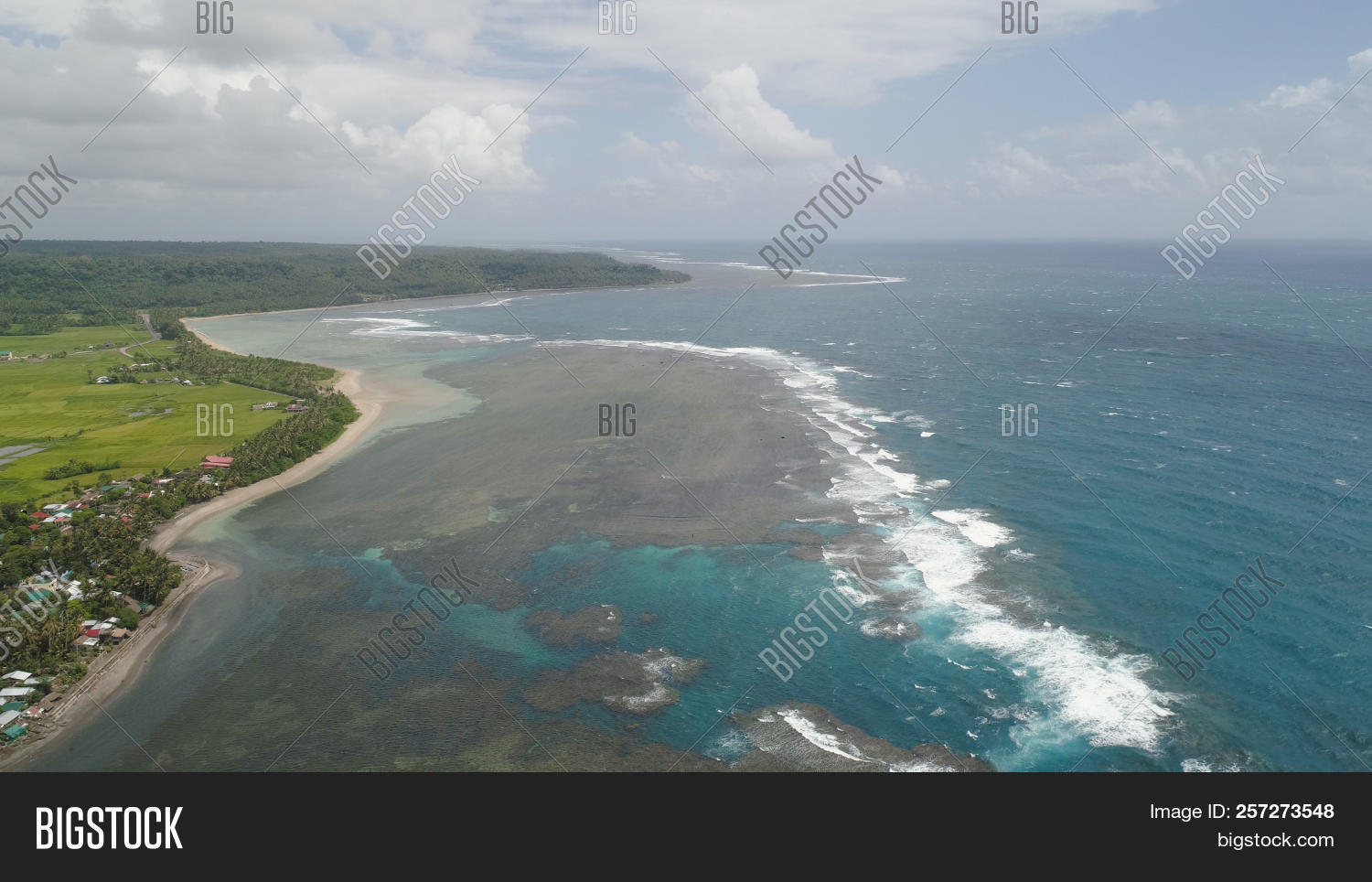 Aerial View Of Seashore With Coastal Town, Beach, Lagoons And Coral ...