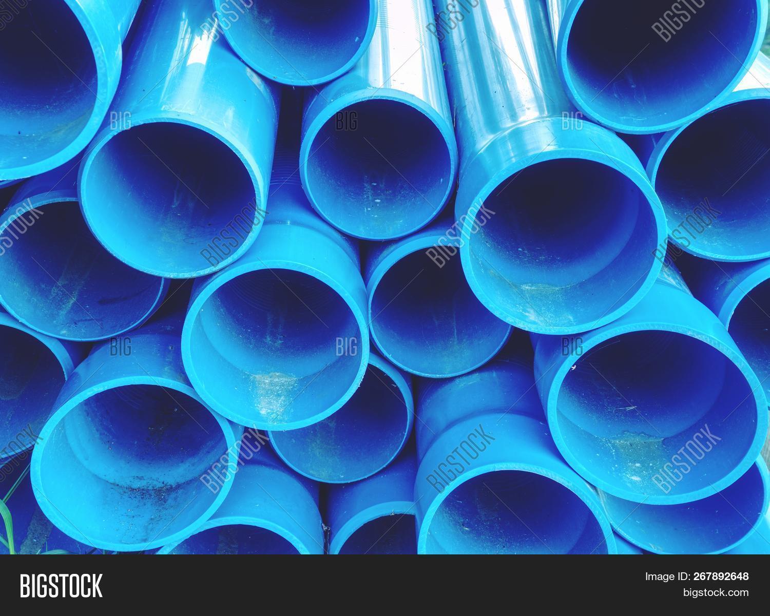 Bundles Of Blue Plastic Pipes For Water Transport. Pipe Batch ...