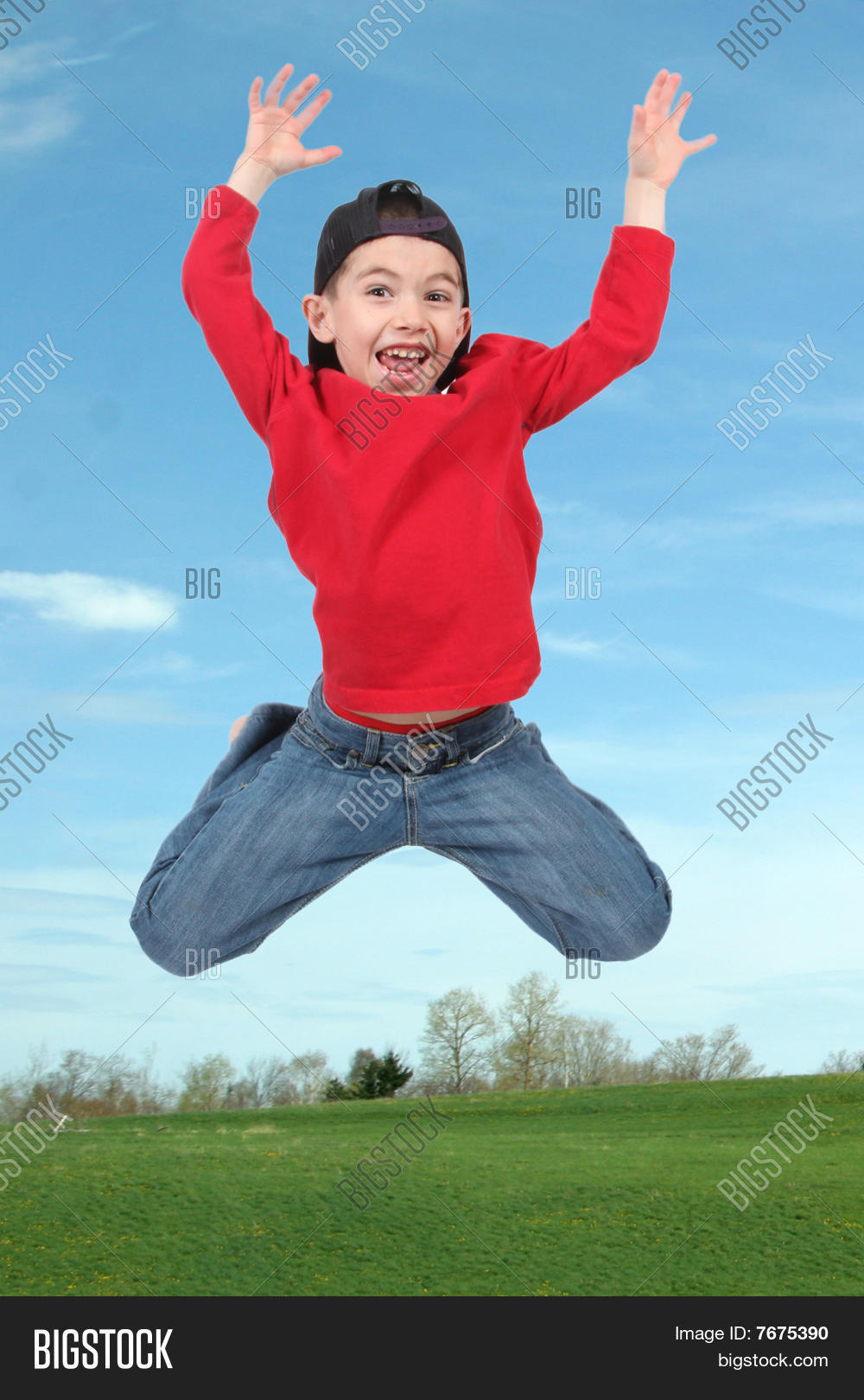 Little Boy Jumping In Air image & stock photo. 7675390