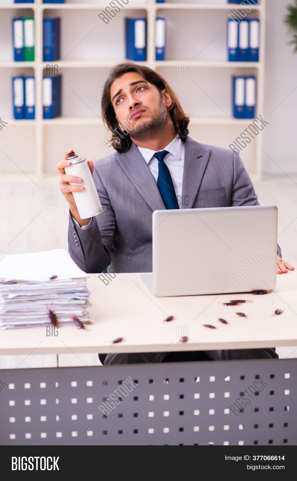 Young male employee and too many cockroaches in the office image ...