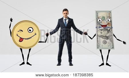 A businessman holding hands with large anthropomorphic golden coin and ...