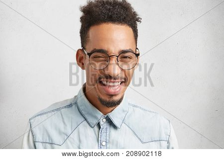 Positive Male With Beard And Mustache Blinks With Eyes, Smiles Or Grins ...