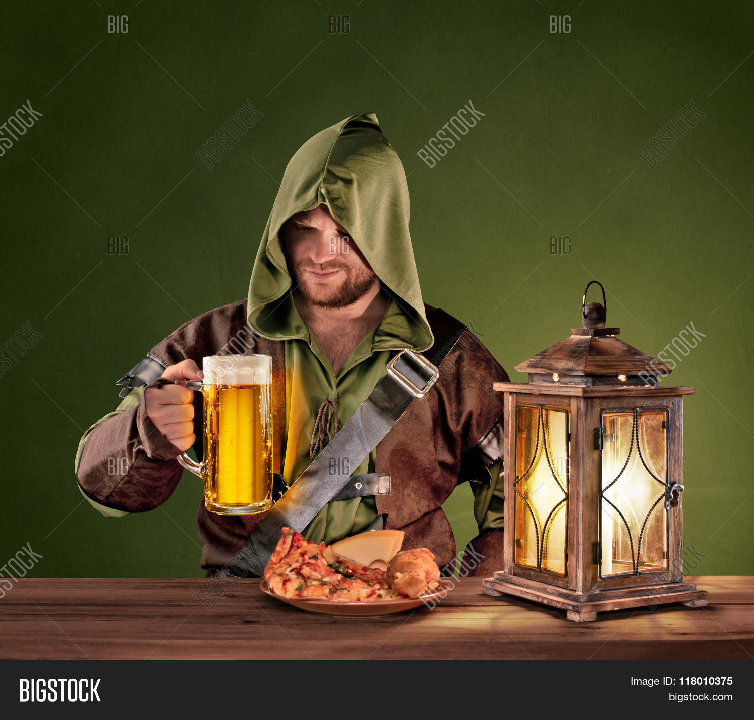 medieval man in a tavern with a beer on the vintage background image ...