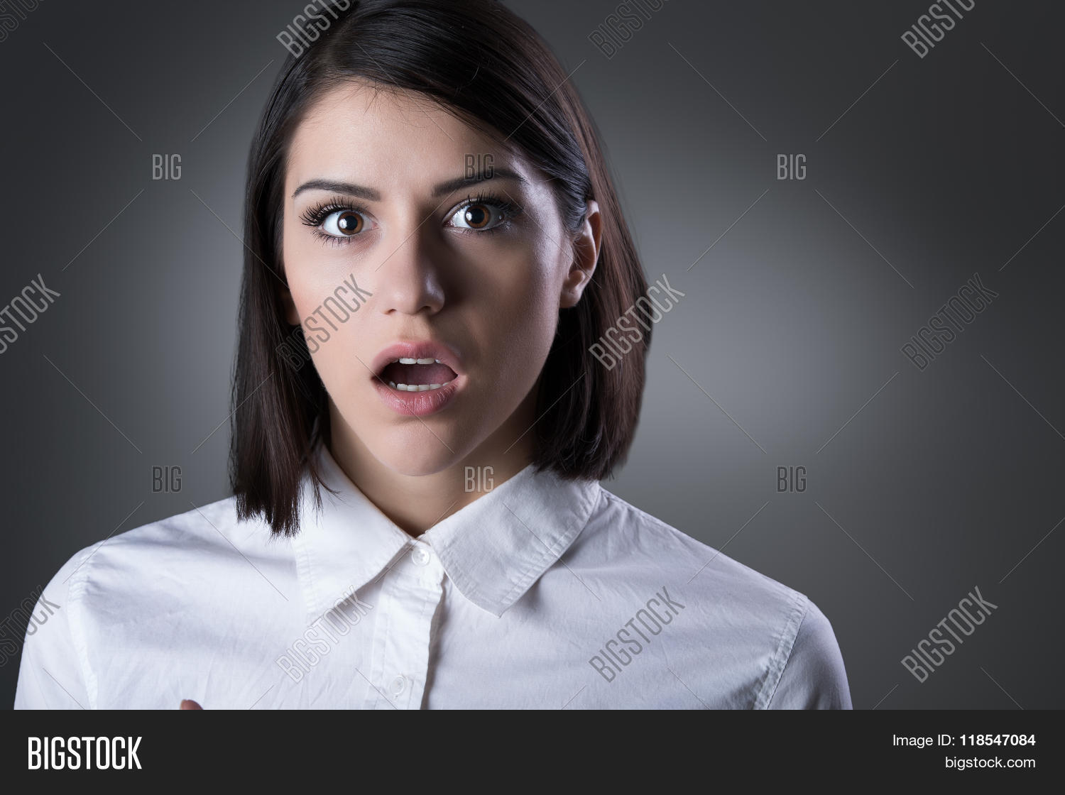 Excited woman looking surprised and amazed,speechless with mouth open ...