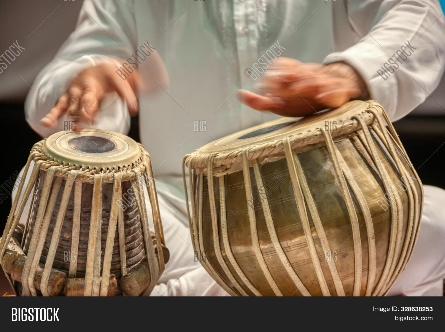 Indian man playing the tabl drums, traditional Indian drums. image ...