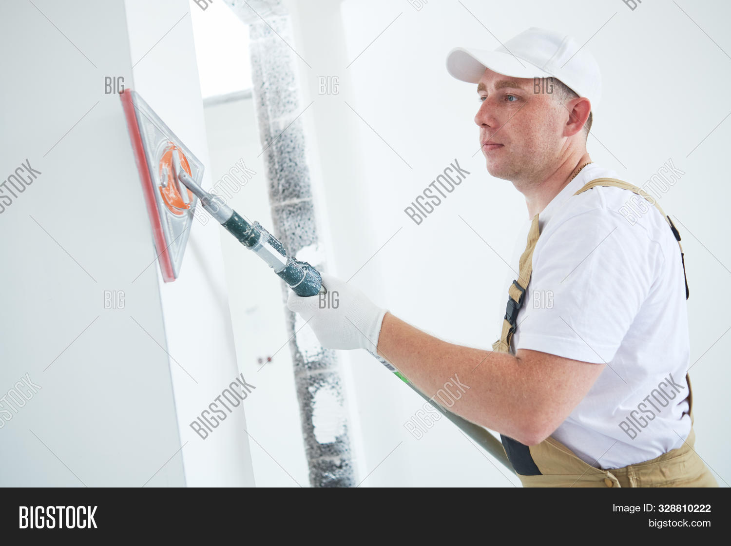 Painter work angle sander. sanding the wall corner surface after putty ...