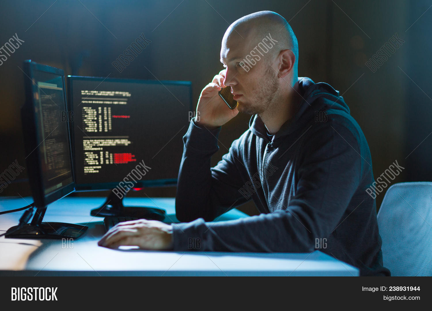 cybercrime, hacking and technology concept - male hacker in dark room ...