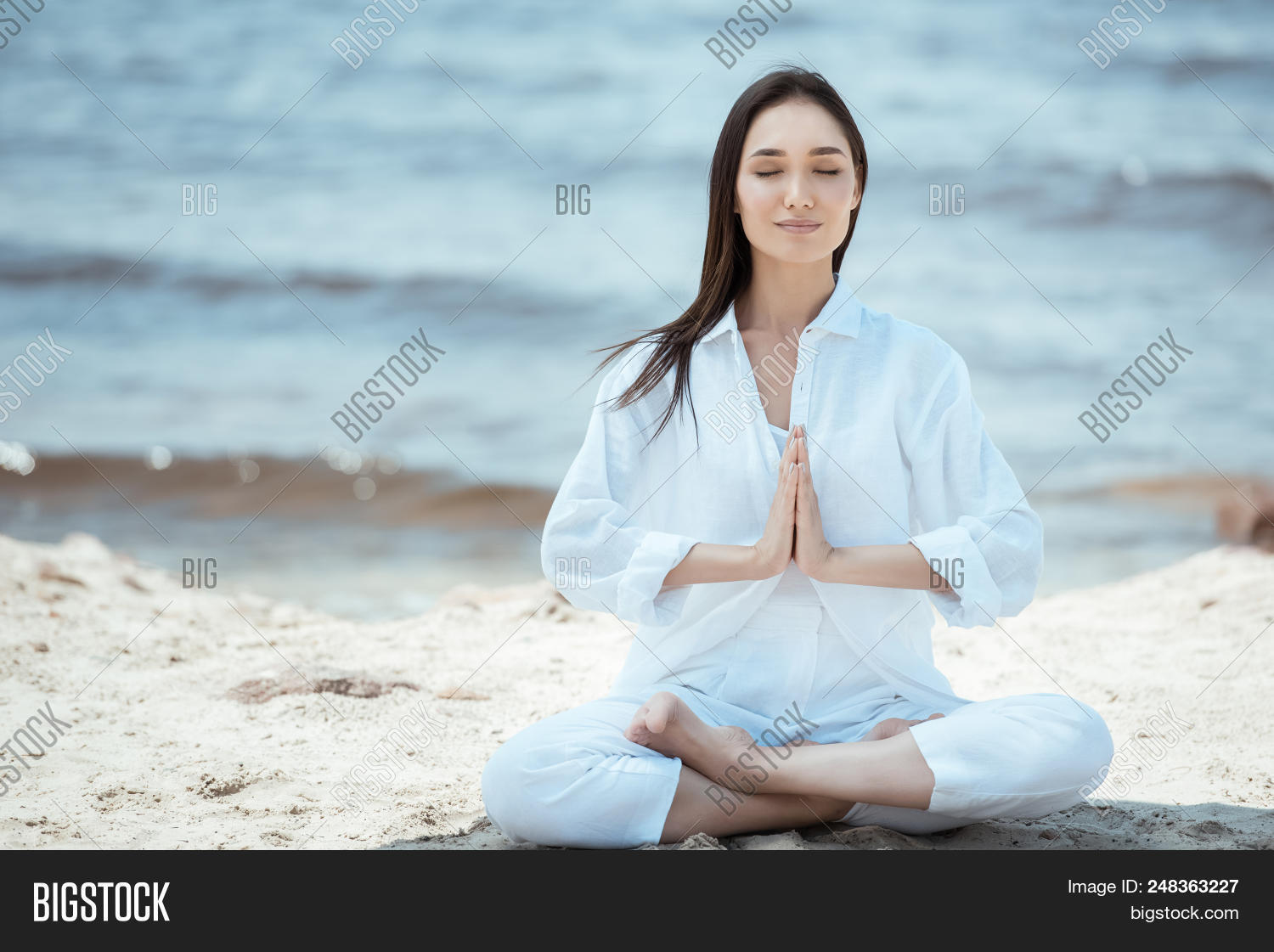 Concentrated Young Asian Woman In Anjali Mudra Salutation Seal Pose On ...