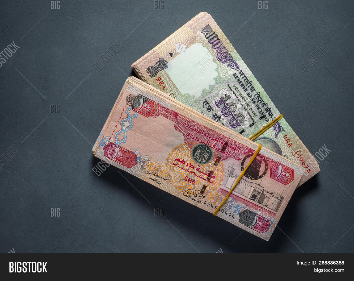 Hundred Indian Rupees And UAE Dirhams Currency Notes Placed Together Hundred Indian Rupees And UAE Dirhams Currency Notes Placed Together