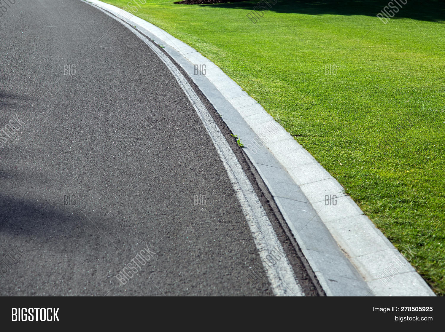 Asphalt Road With Stormwater On The Side Of The Road With A Ditch For ...