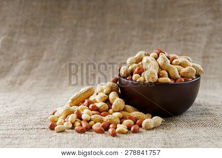 Peanuts In The Shell And Peeled Close-up In Cups. Roasted Peanuts In ...