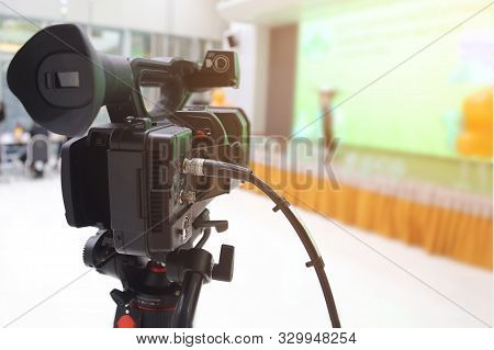 Camera Filming On A Tripod Is Broadcasting Live On Stage. Video Camera ...