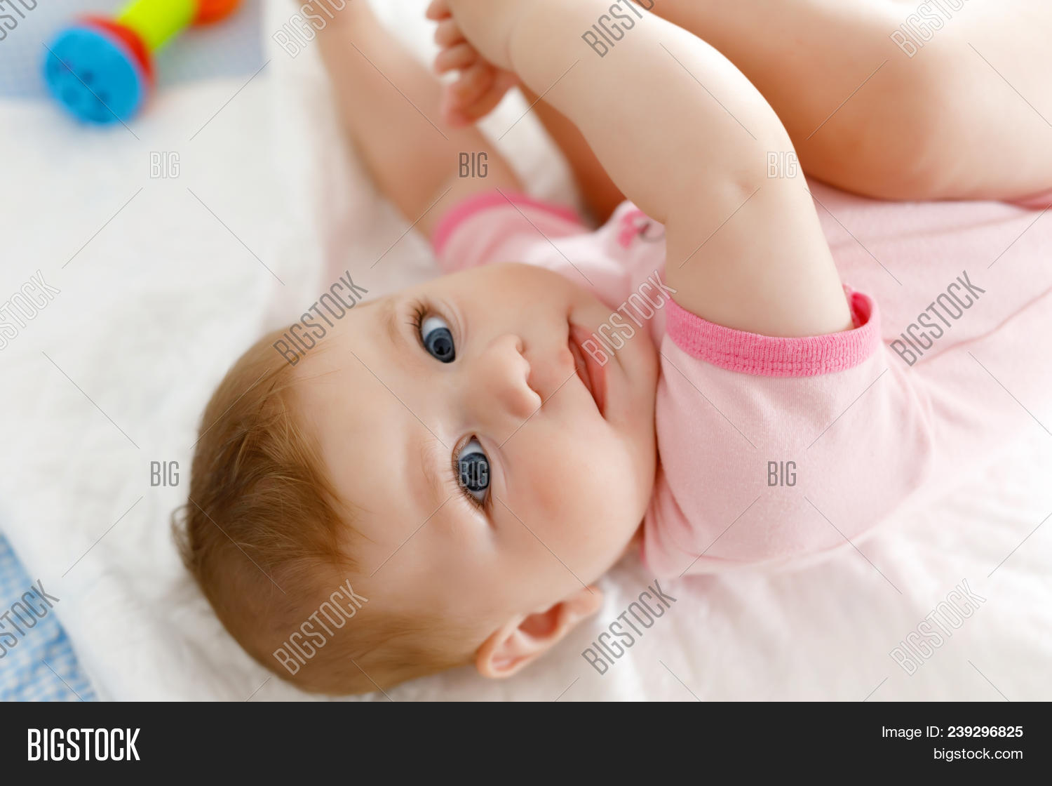 Cute Baby Taking Feet In Mouth. Adorable Little Baby Girl Sucking Own ...