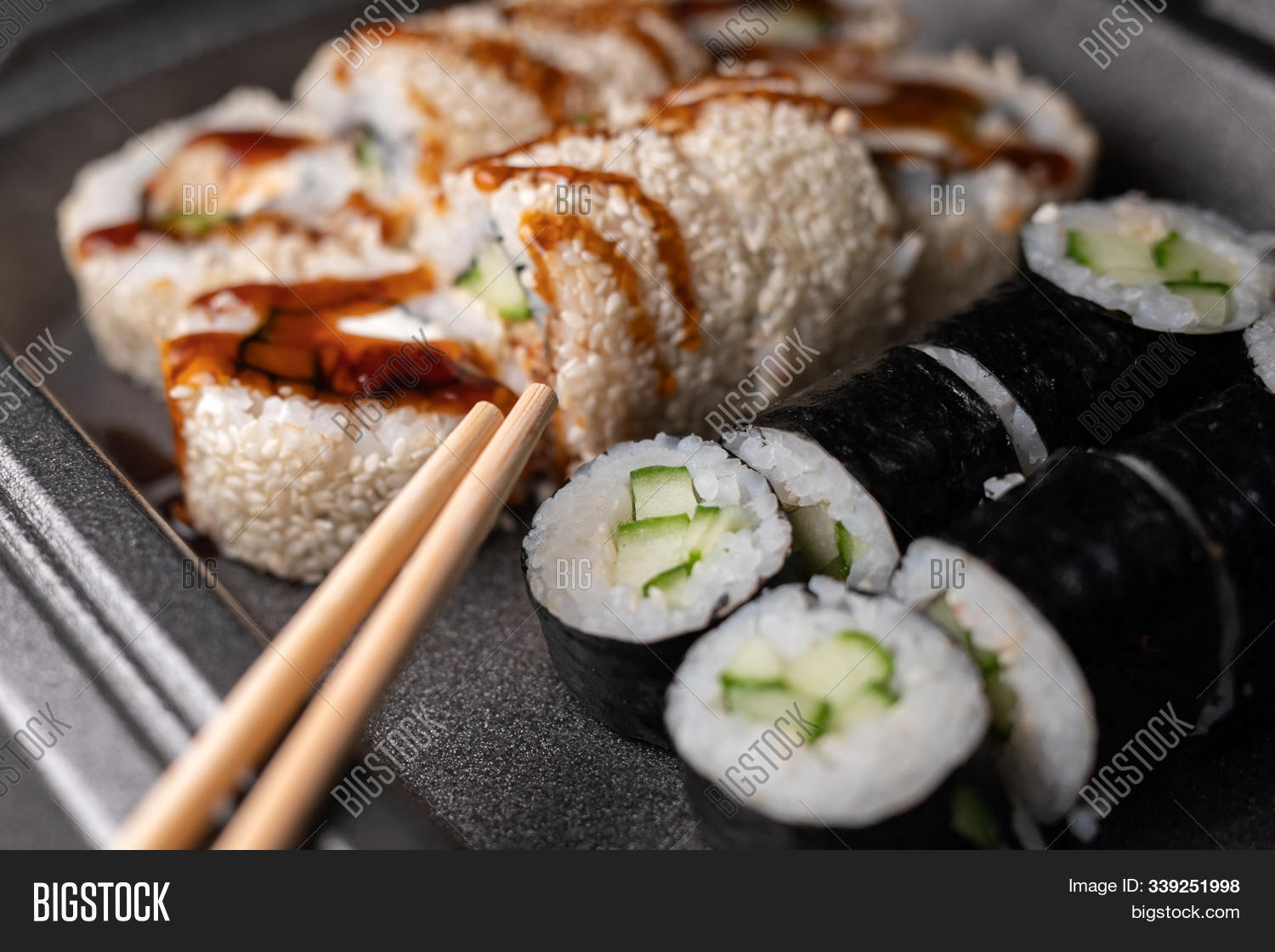 Sushi Rolls With Cream Cheese, Nori And Cucumber Covered With Eel ...