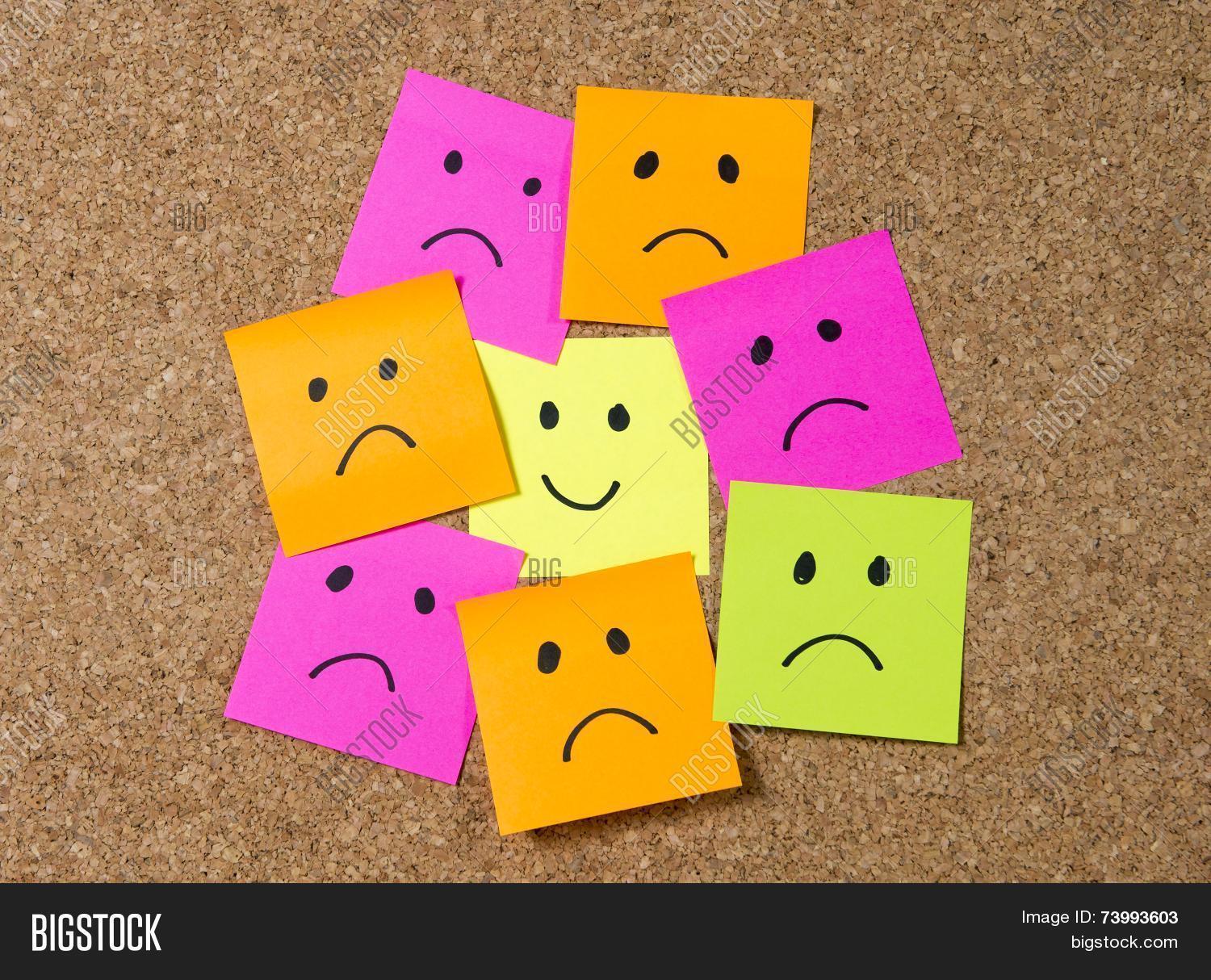 Smiley Post It Note On Corkboard In Happiness Versus Depression Concept ...