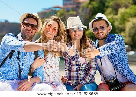 Group of friends taking funny portraits outdoor. - Stock Image - Everypixel